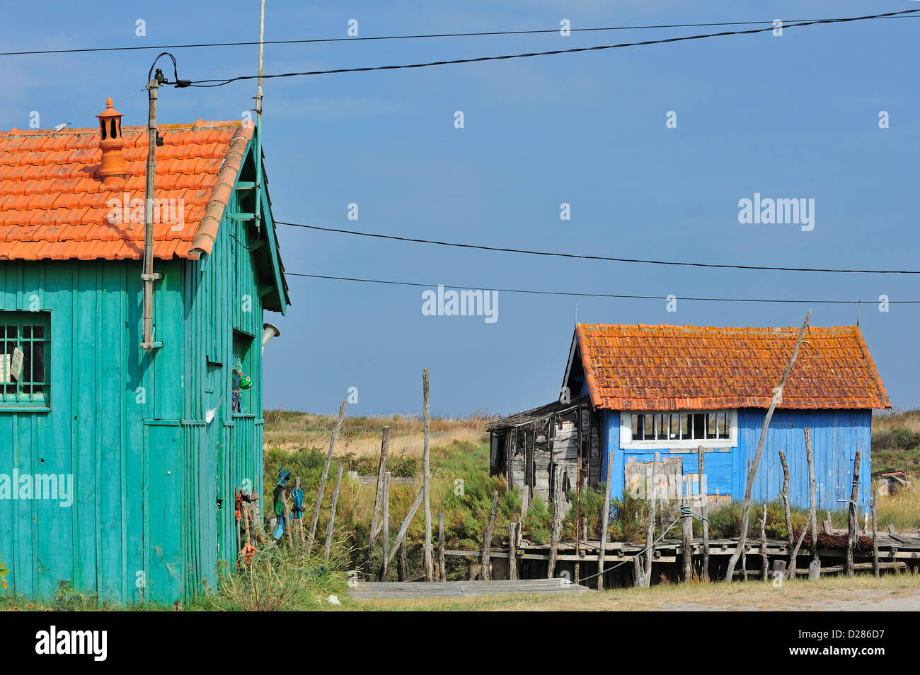 Colourful cabins of oyster farm at la Baudissière, Dolus / Saint-Pierre ...