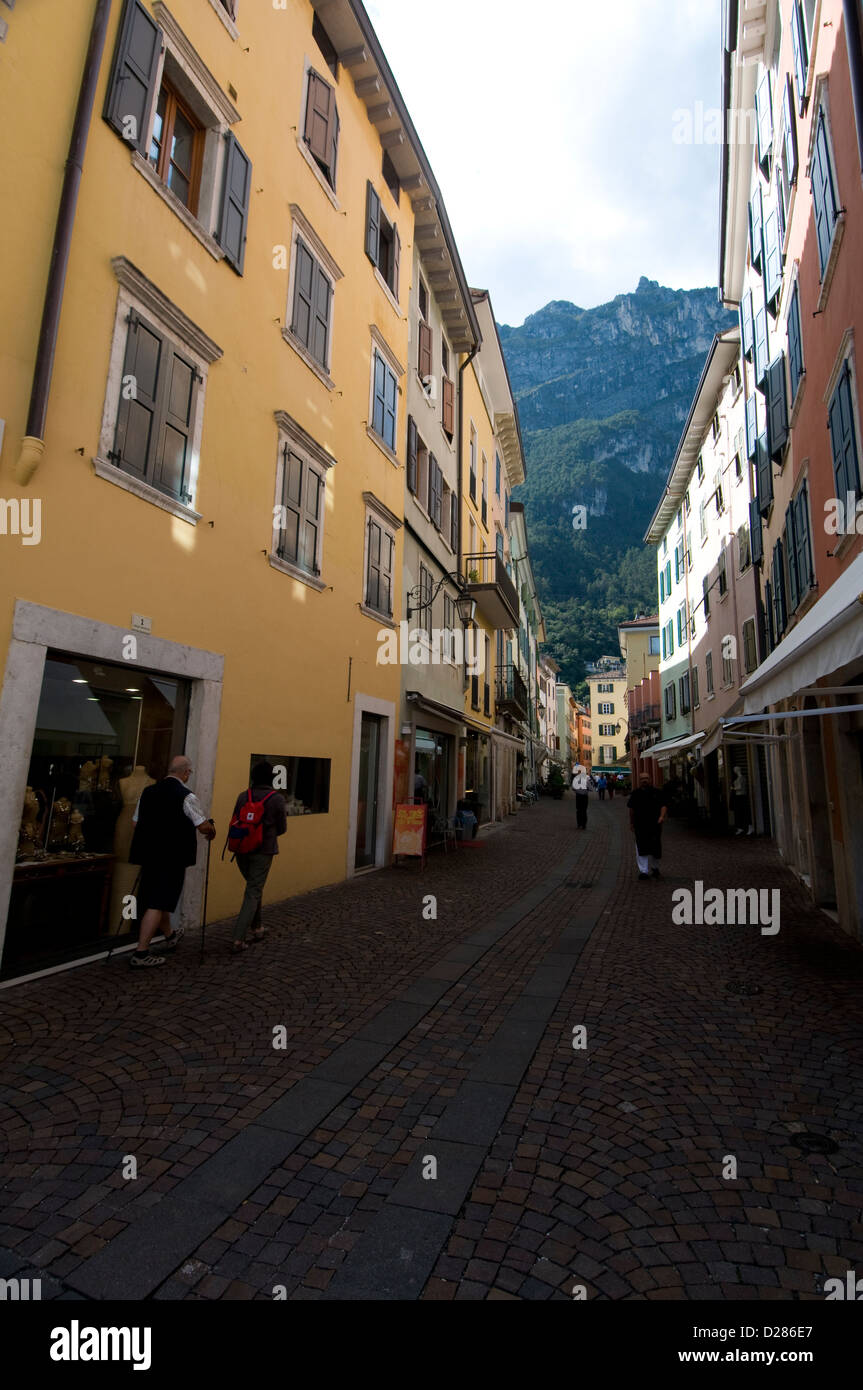 A narrow shopping street, Via Disciplini in the town of Riva, located ...