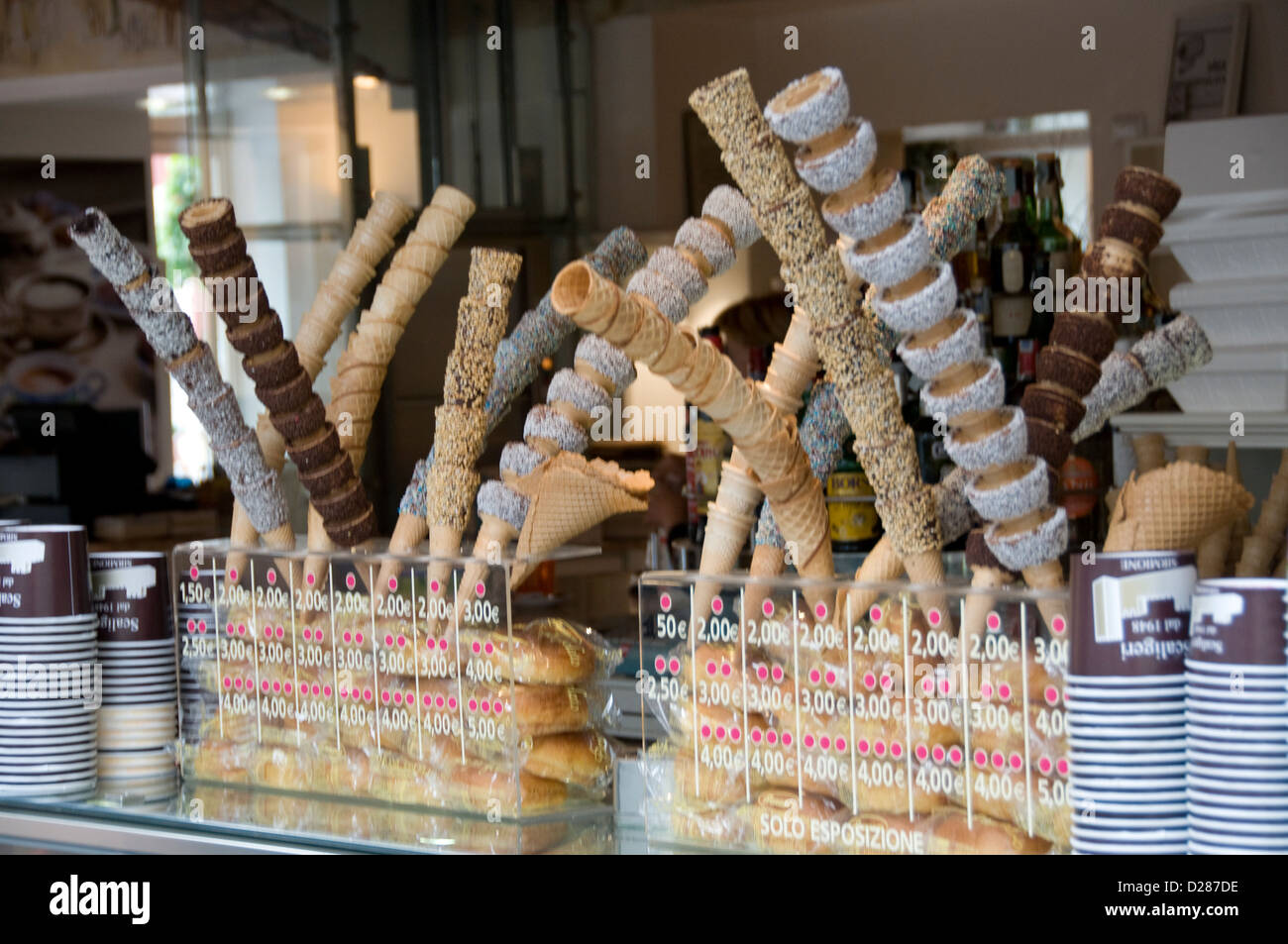 Stack of Italian ice cream cornets on an display stand at an ice cream ...
