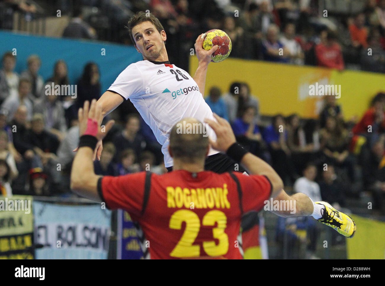 Adrian Pfahl (back) of Germany takes a shot while Zoran Roganovic of ...