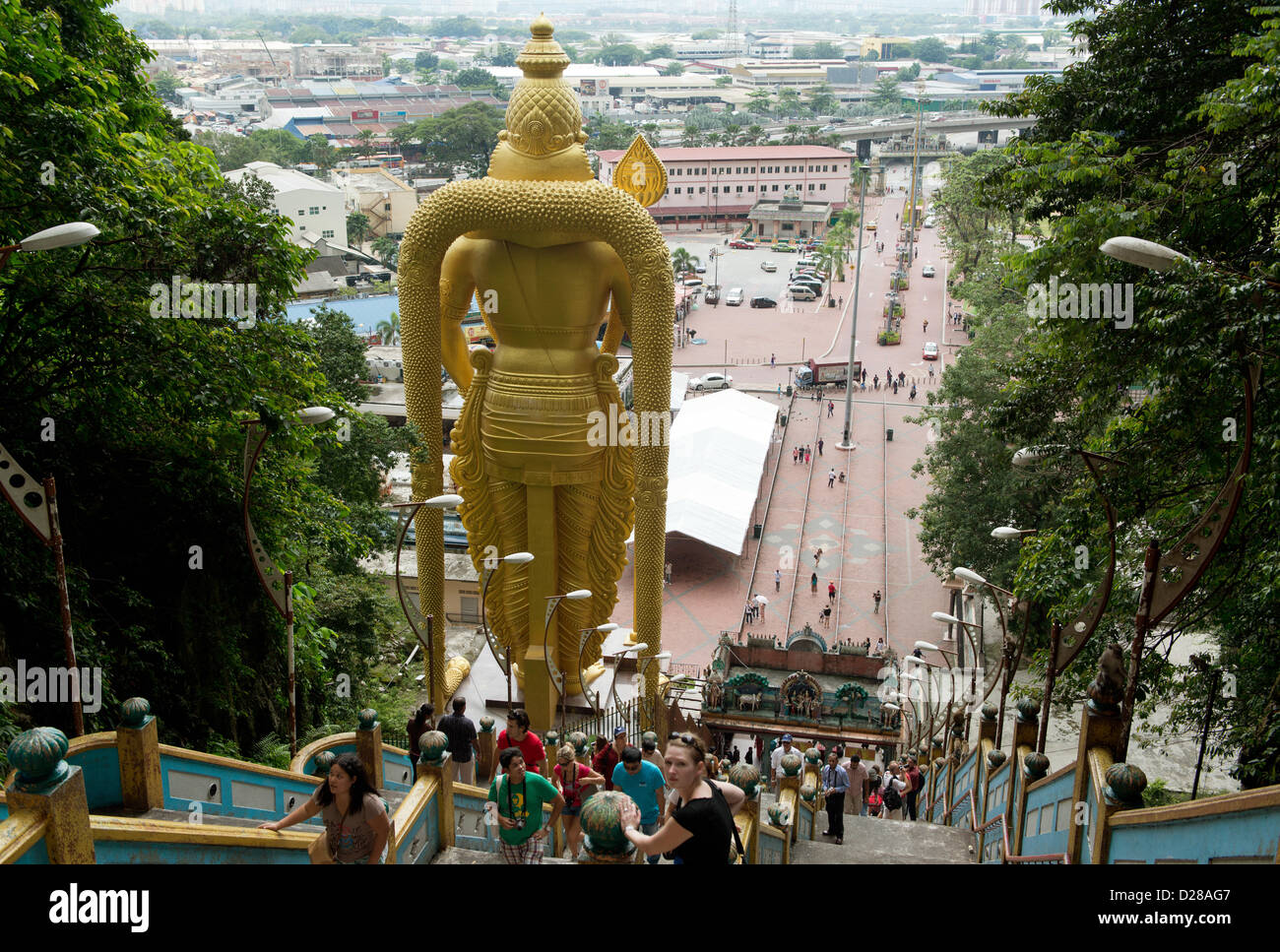 A golden statue towers in front the entrance to the round 300 steps ...