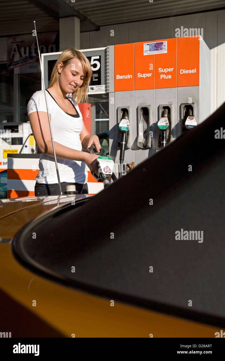 Woman refuels car hi-res stock photography and images - Alamy Woman refuels car hi-res stock photography and images - Alamy
