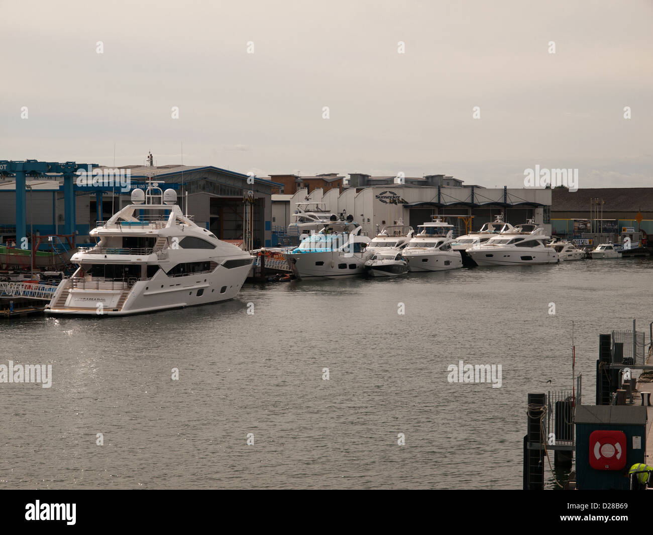 Sunseeker boats berthed adjacent to the Sunseeker factory Poole Dorset ...