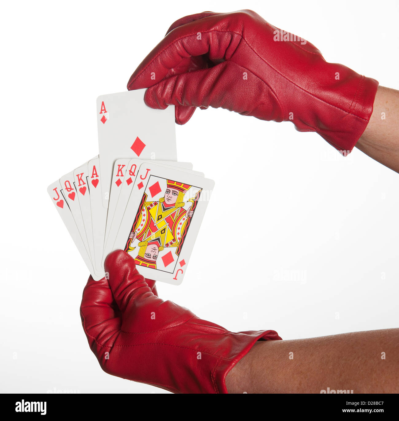 Playing cards in woman's red gloved hand Stock Photo - Alamy
