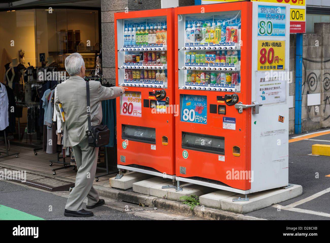 A Man Uses a road side Vending Machine in Shinjuku Tokyo Stock Photo ...