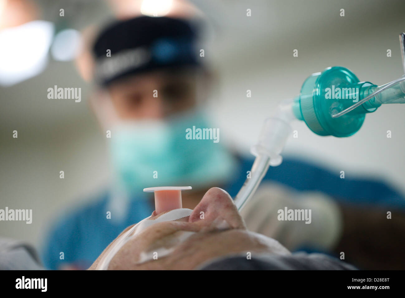 Anesthesiologist wearing surgical mask with a patient with ...