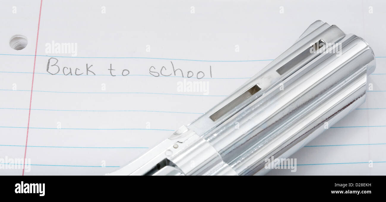Handgun with school notebook paper Stock Photo - Alamy