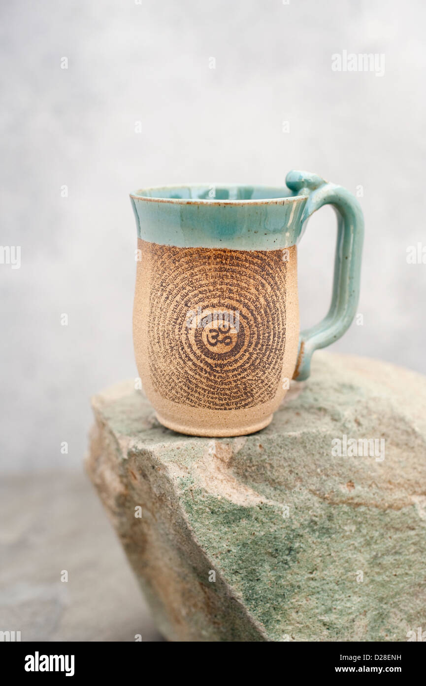 Yoga OM cup Stock Photo - Alamy