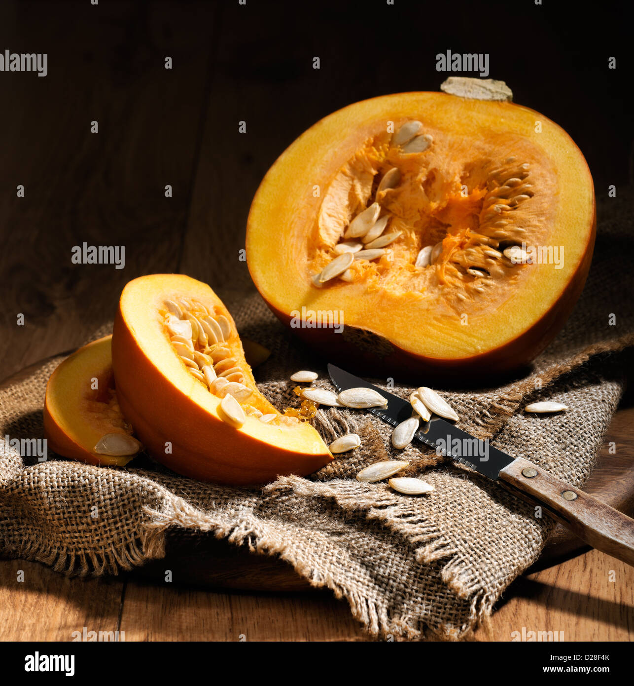 Sliced pumpkin pieces for Halloween night Stock Photo - Alamy