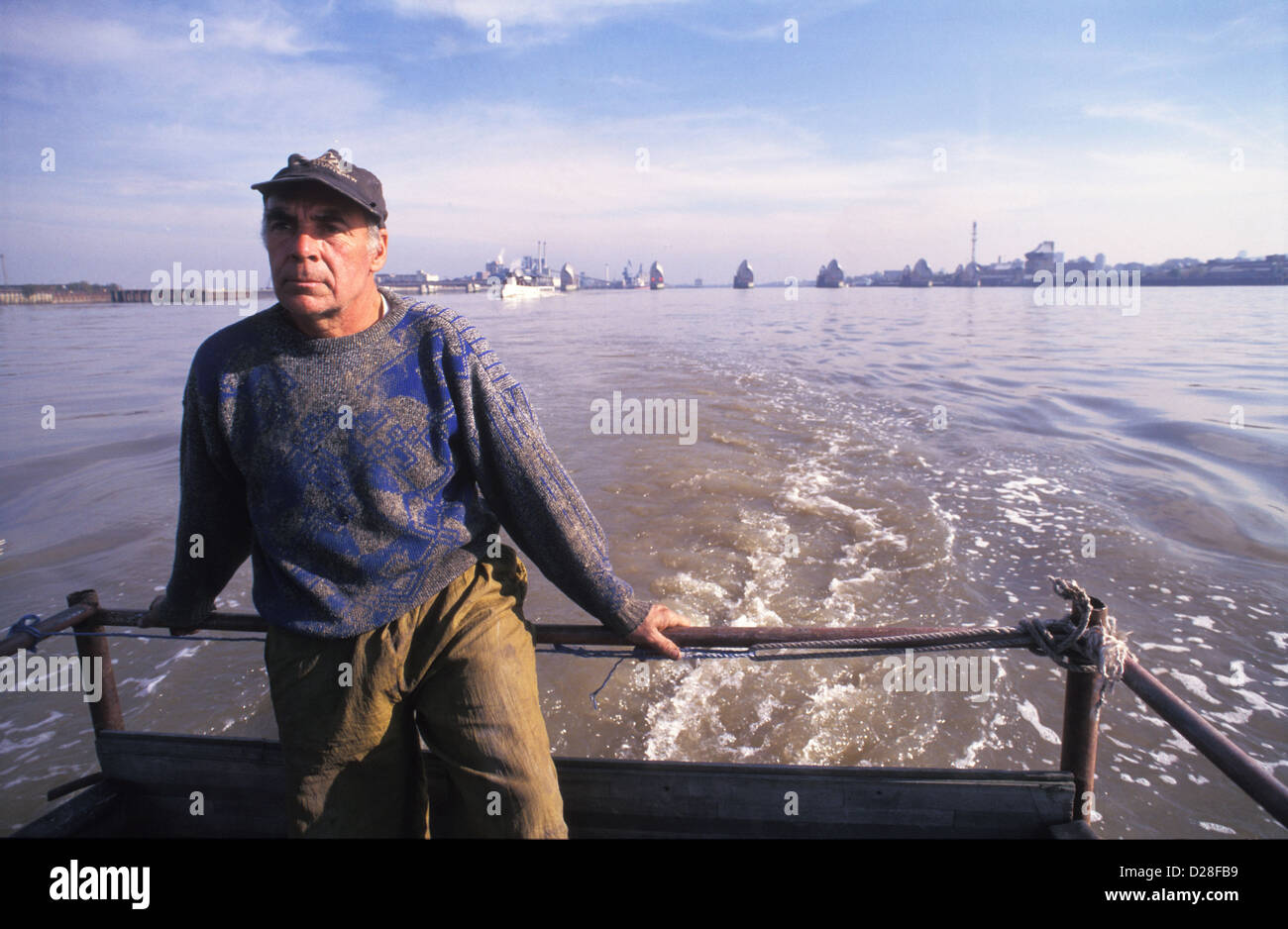 Weekend boating enthusiast taking a small boat up the river, the Thames ...