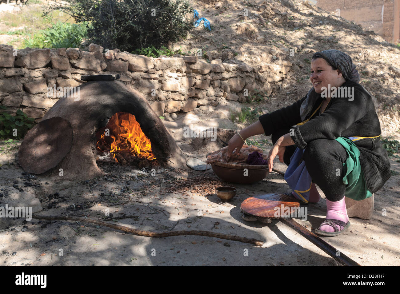 Woman baking bread, Berber Village of the High Atlas Mountains ...