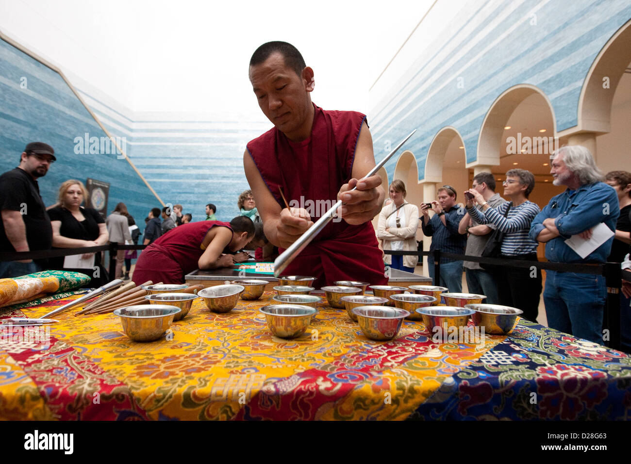 Tibetan Buddhist monks from the Drepung Loseling Monastery, construct ...