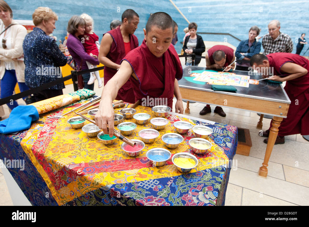 Tibetan Buddhist monks from the Drepung Loseling Monastery, construct ...