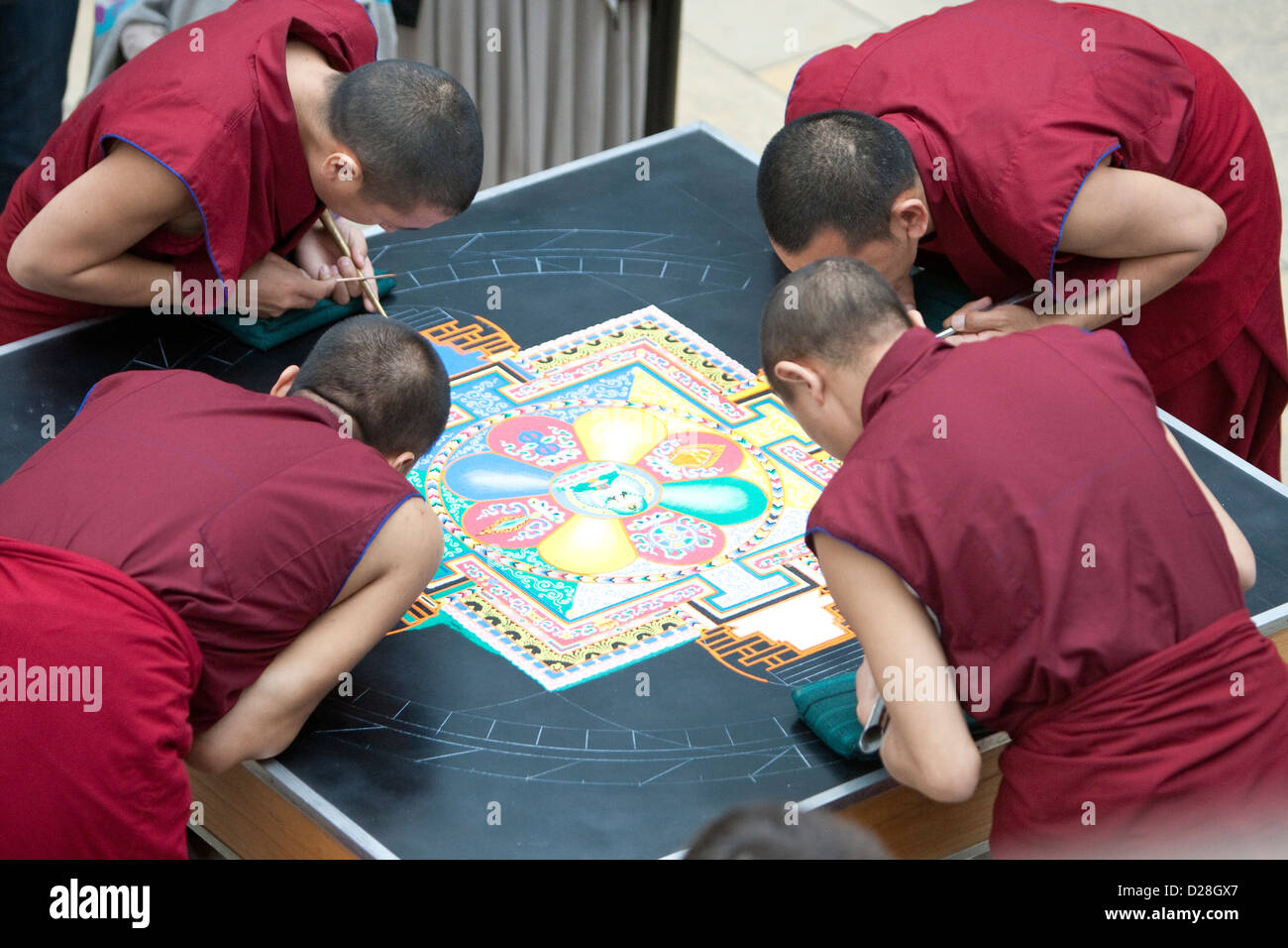 Tibetan Buddhist monks from the Drepung Loseling Monastery, construct ...