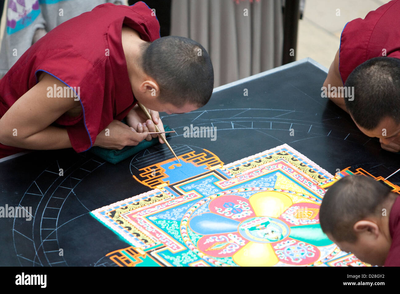 Tibetan Buddhist monks from the Drepung Loseling Monastery, construct ...