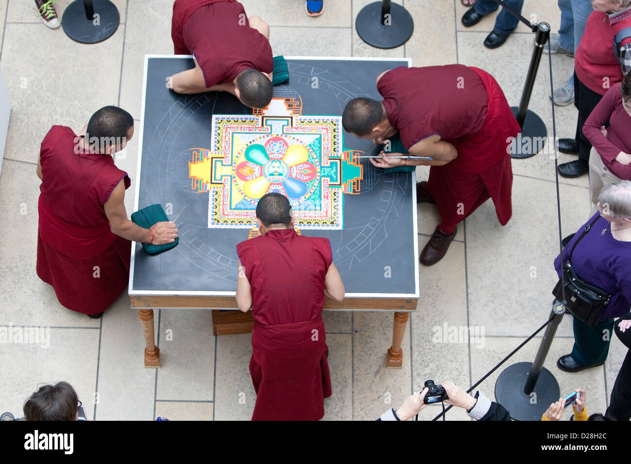 Tibetan Buddhist monks from the Drepung Loseling Monastery, construct ...