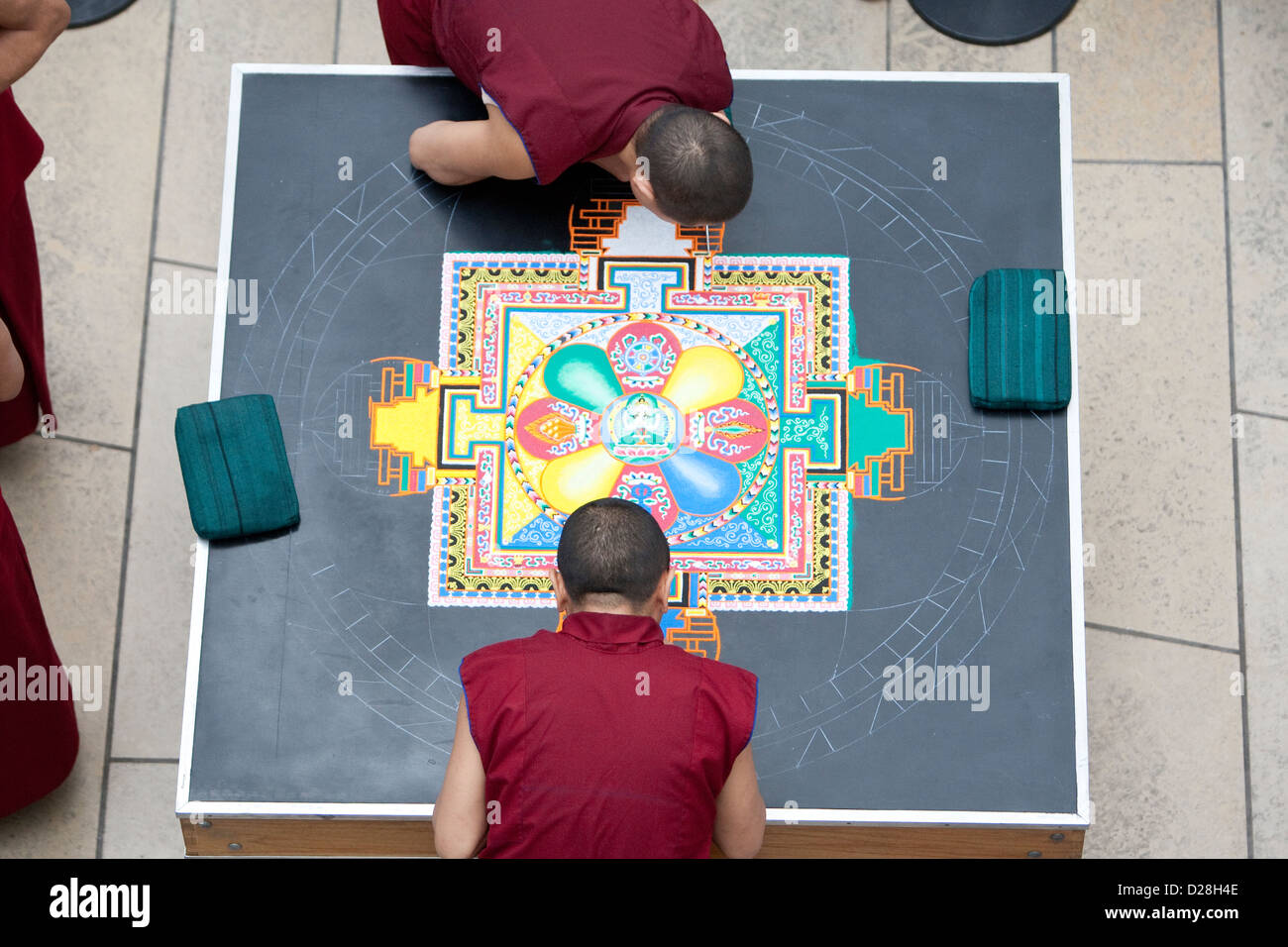 Tibetan Buddhist monks from the Drepung Loseling Monastery, construct ...