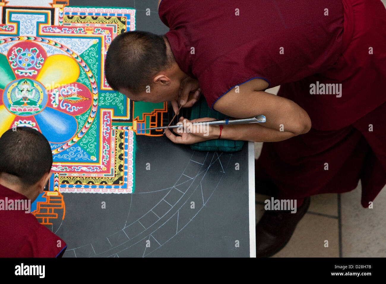 Tibetan Buddhist monks from the Drepung Loseling Monastery, construct ...