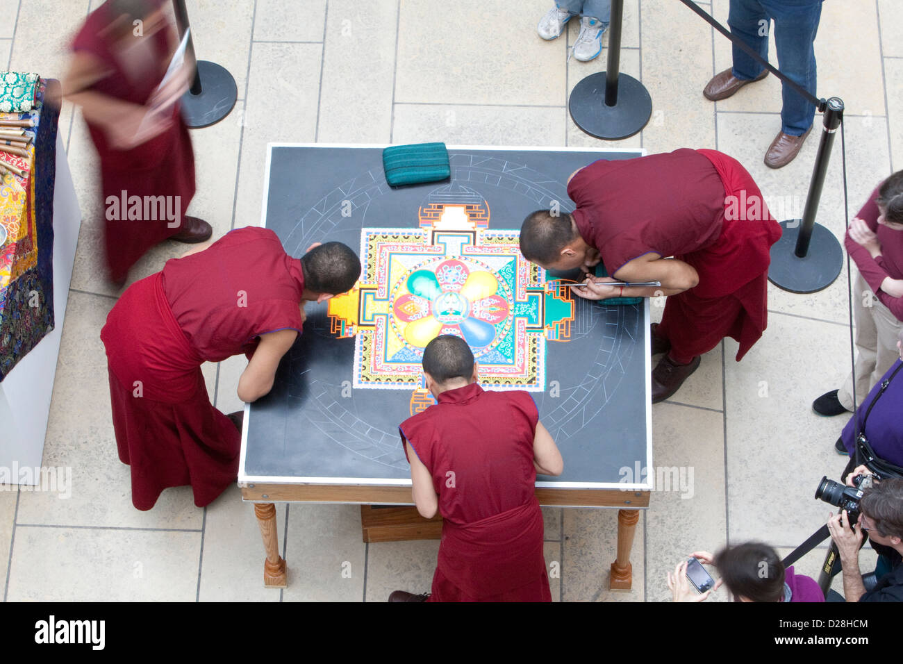 Tibetan Buddhist monks from the Drepung Loseling Monastery, construct ...