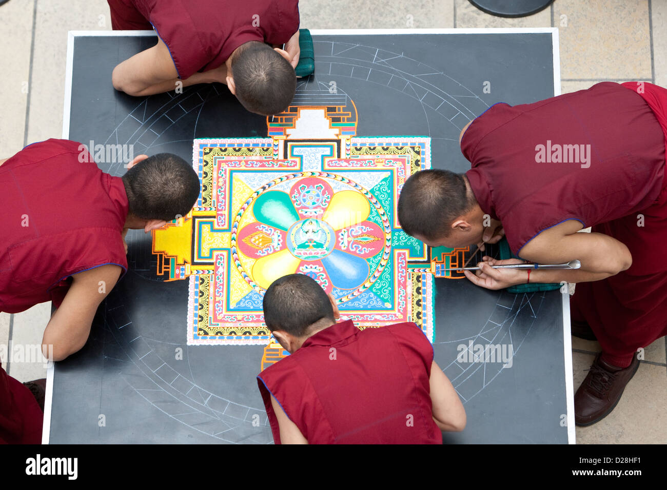 Tibetan Buddhist monks from the Drepung Loseling Monastery, construct ...