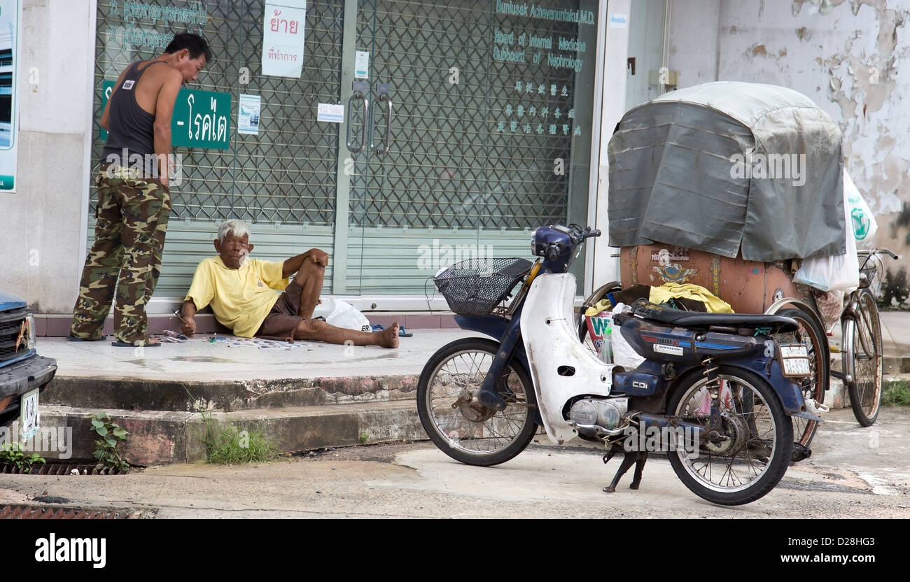 Men play a traditional game in the street Stock Photo - Alamy