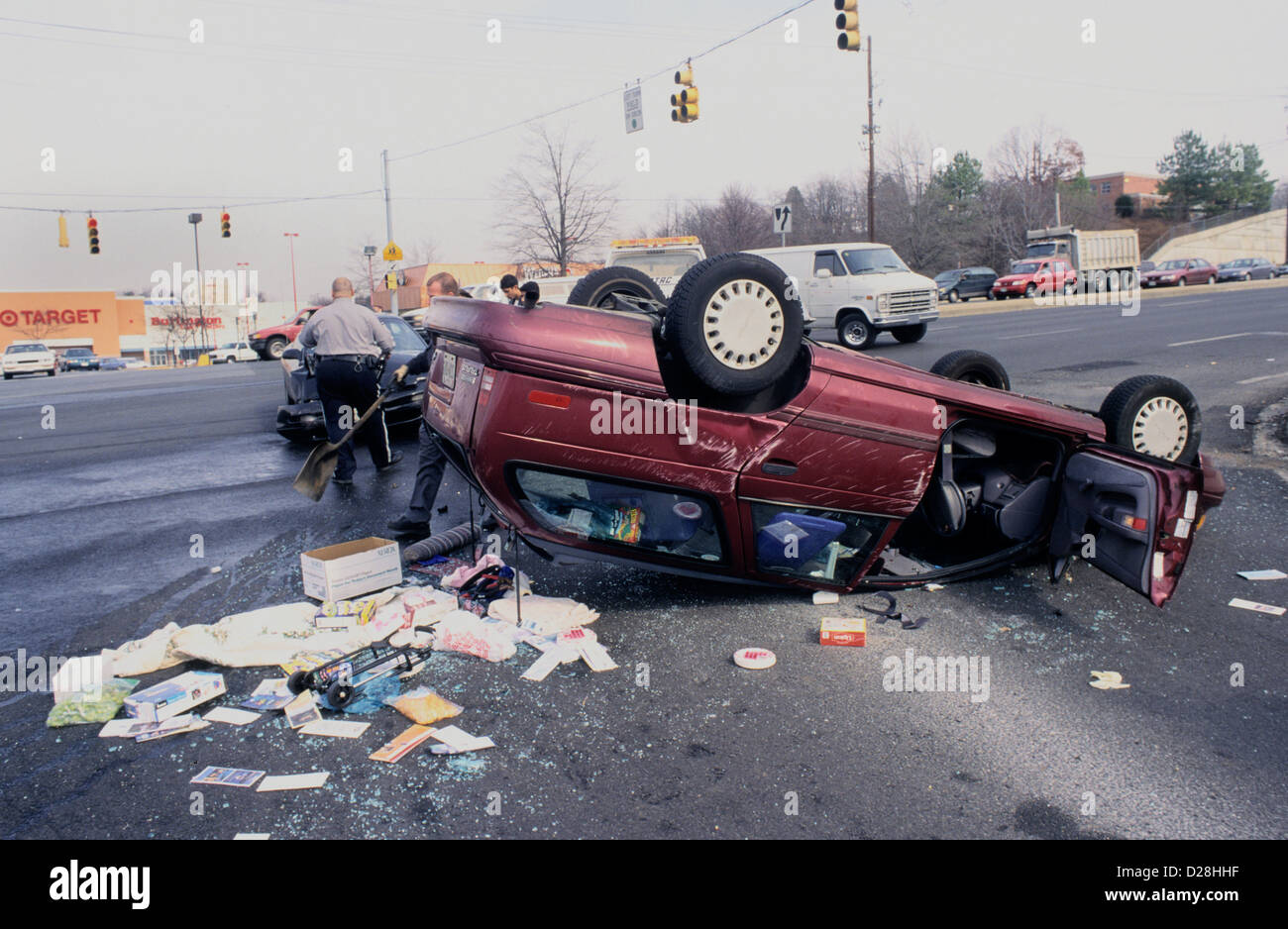 Police inspect an overturned car Stock Photo - Alamy