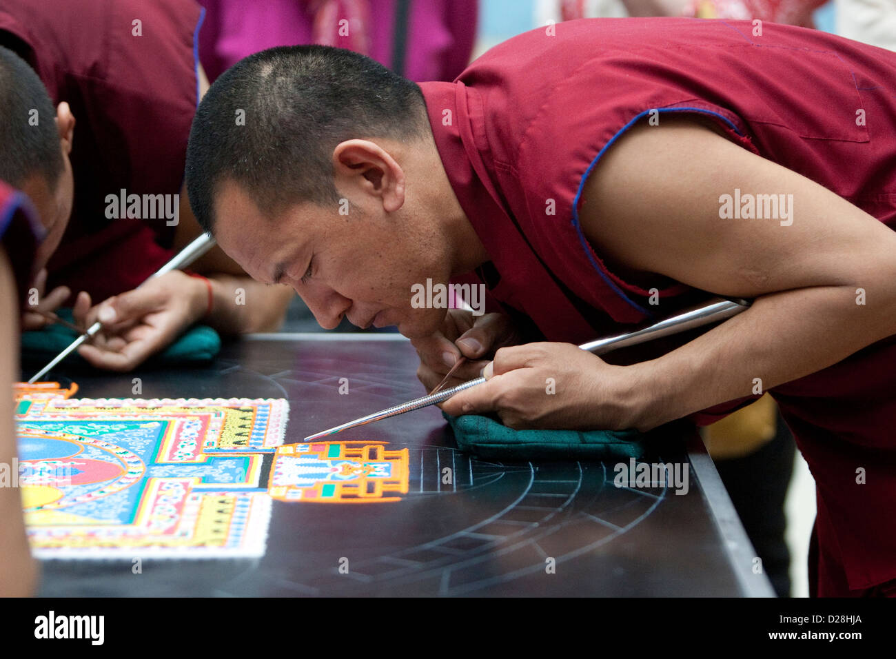 Tibetan Buddhist monks from the Drepung Loseling Monastery, construct ...