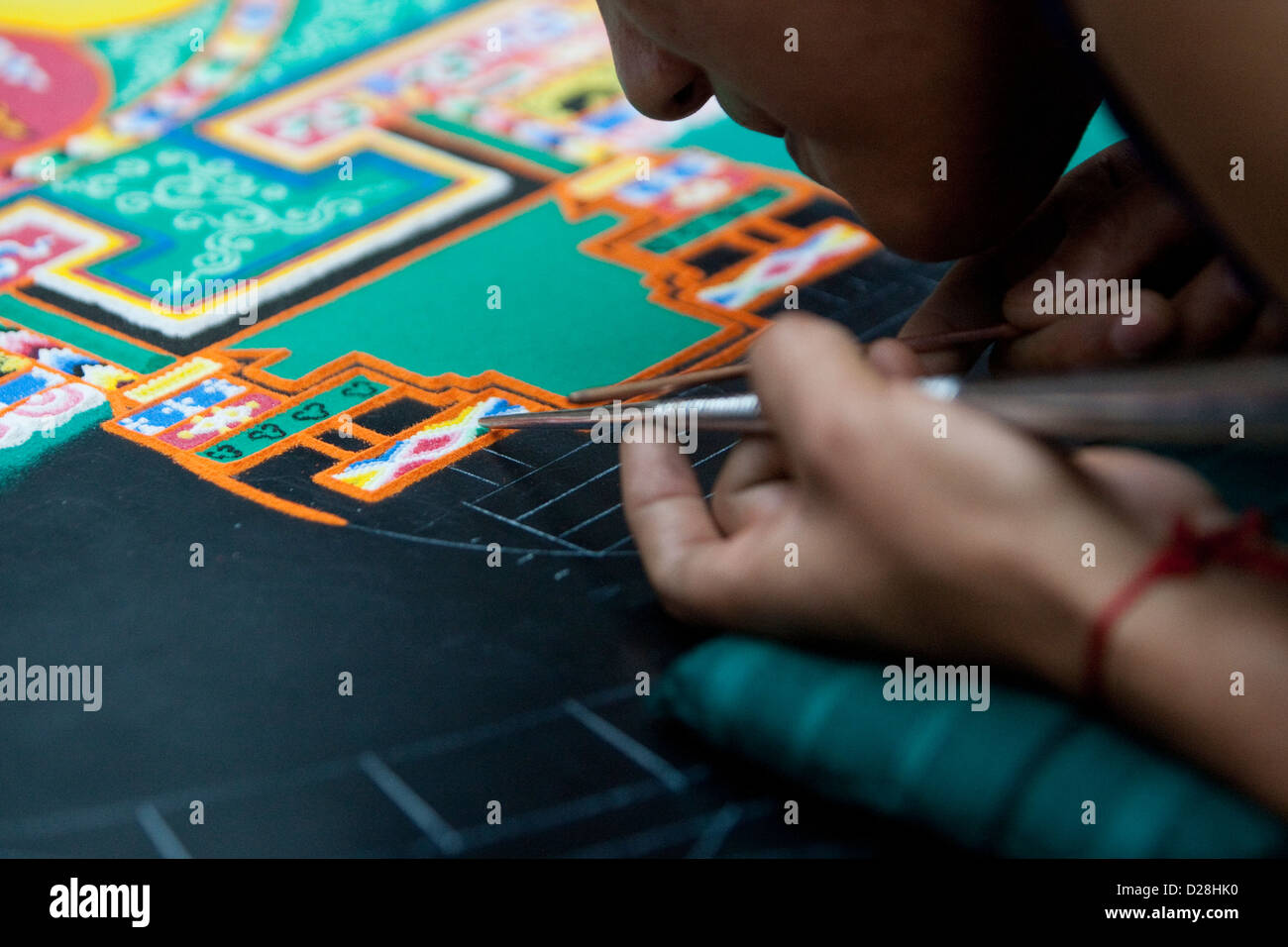 Tibetan Buddhist monks from the Drepung Loseling Monastery, construct ...