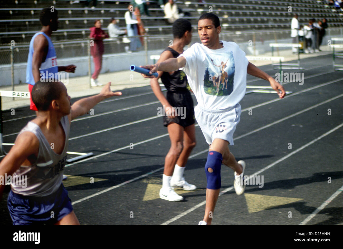 handing off during a high school relay race in Friendly, Maryland Stock ...