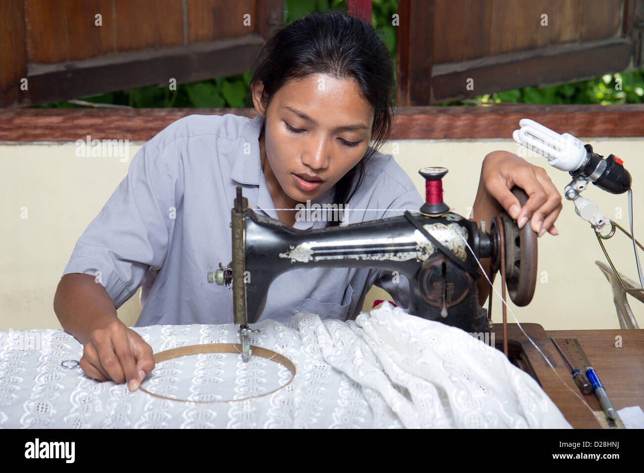 Woman using embroidery machine hi-res stock photography and images - Alamy