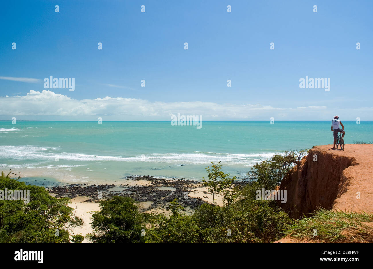cyclist standing on cliff over ocean - Chapadao - Pipa Beach Stock ...