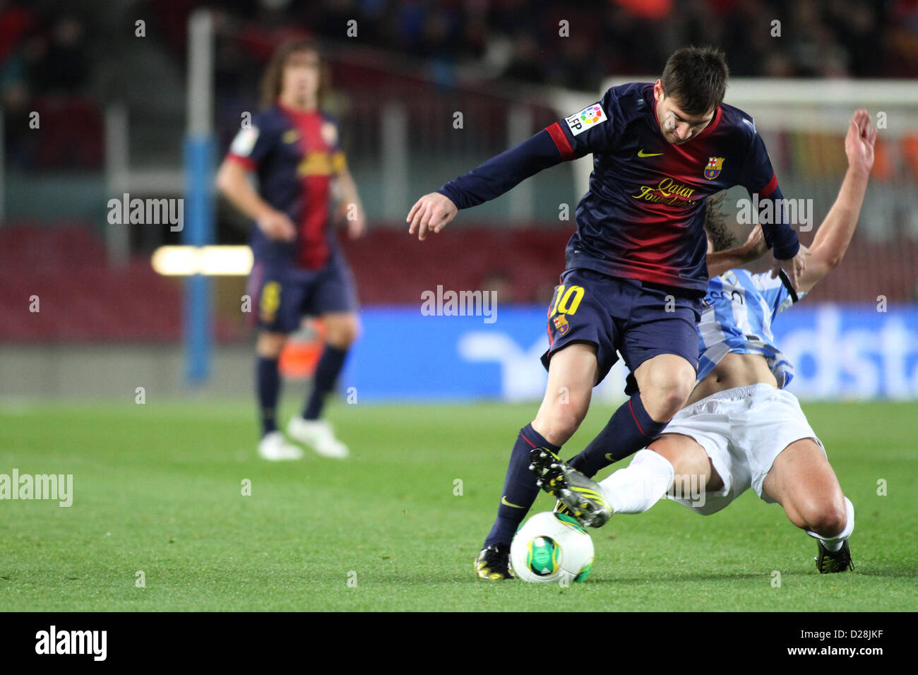 Barcelona, Spain. 16th January 2013. Messi skips past a tackle during ...