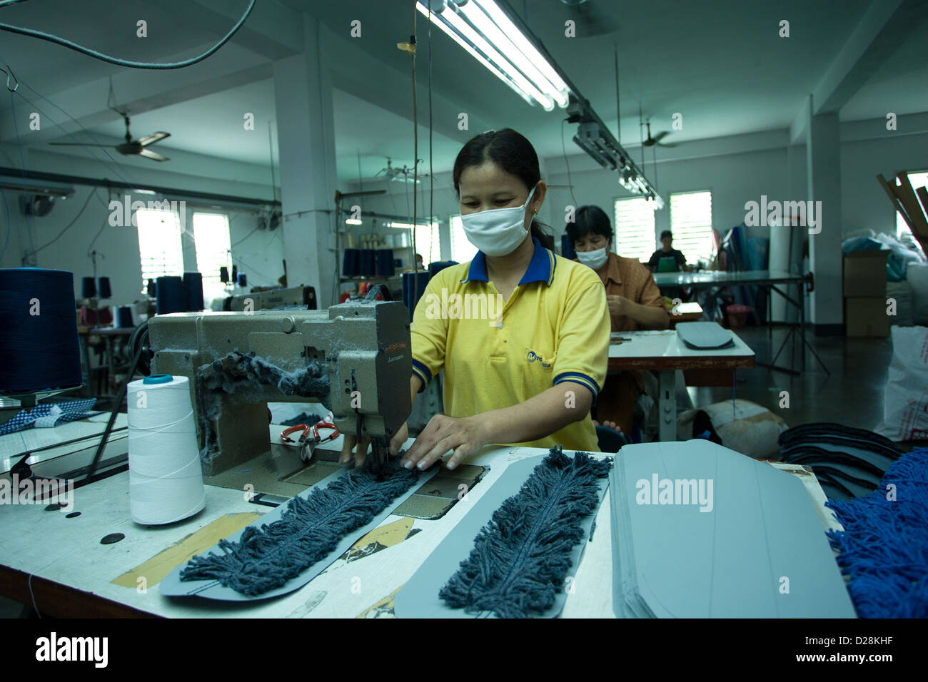 women working on swing machine in a clothing factories, In Bangkok ...
