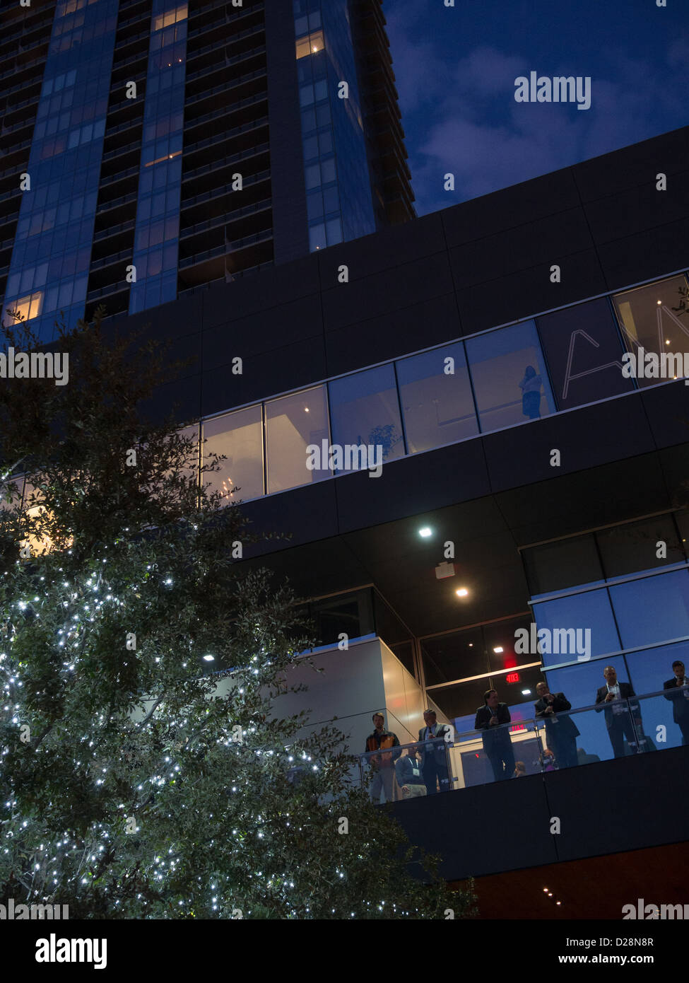 Hotel Guests hang out on the balcony of the W hotel at night in Austin ...