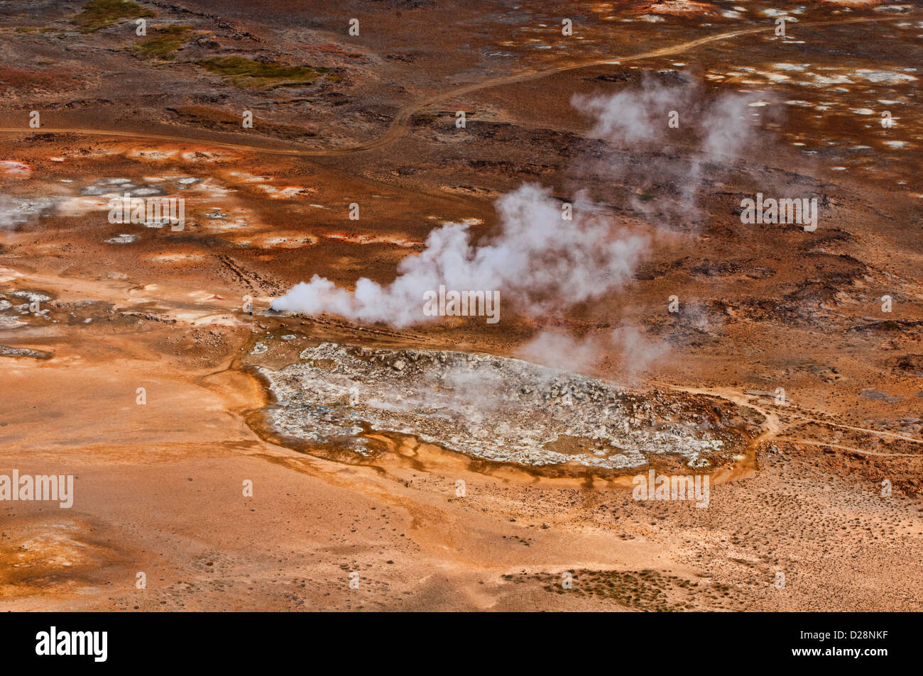 smoking fumaroles at the geothermal area of Hverir near Lake Myvatn ...