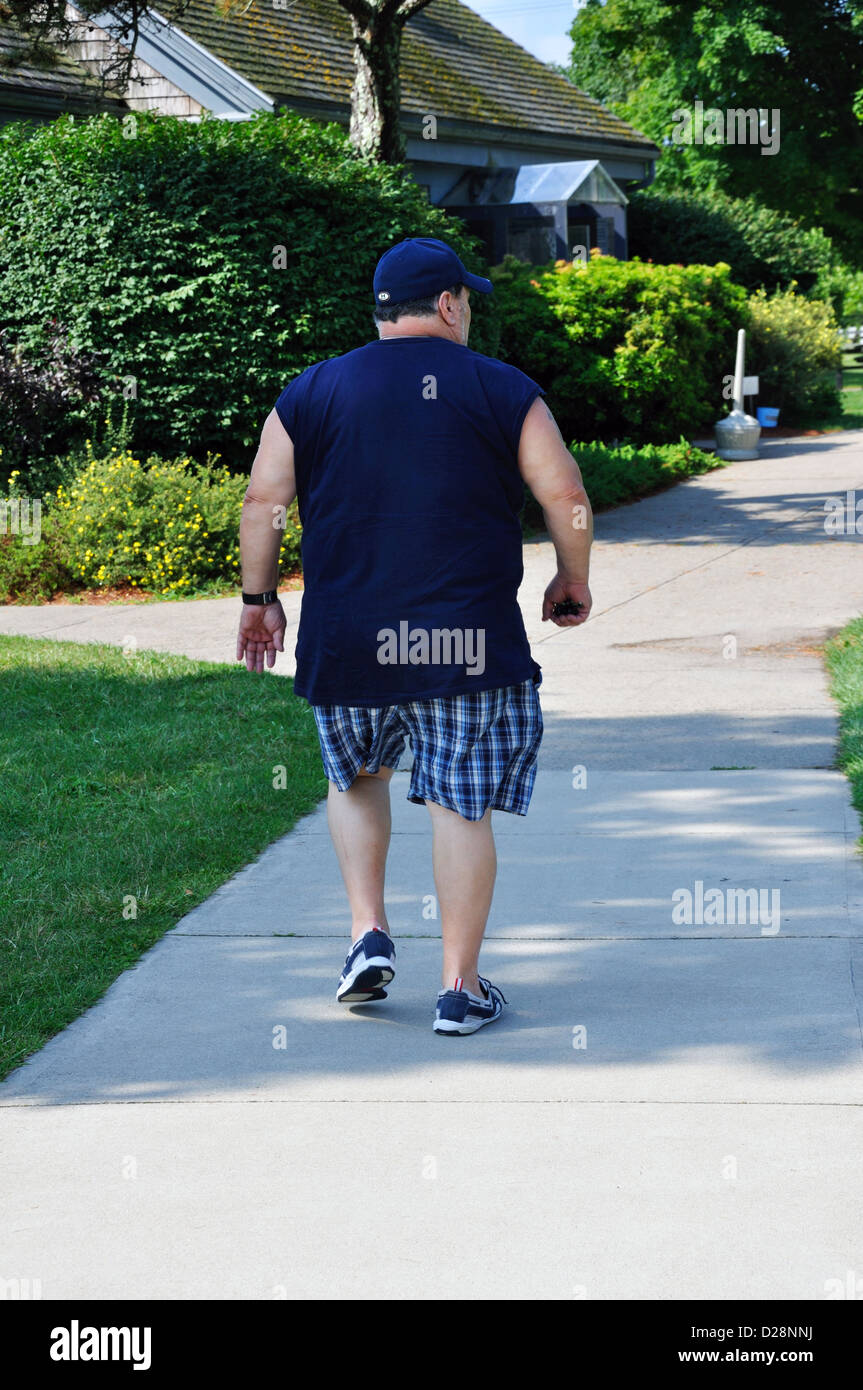 Overweight man walking Stock Photo - Alamy