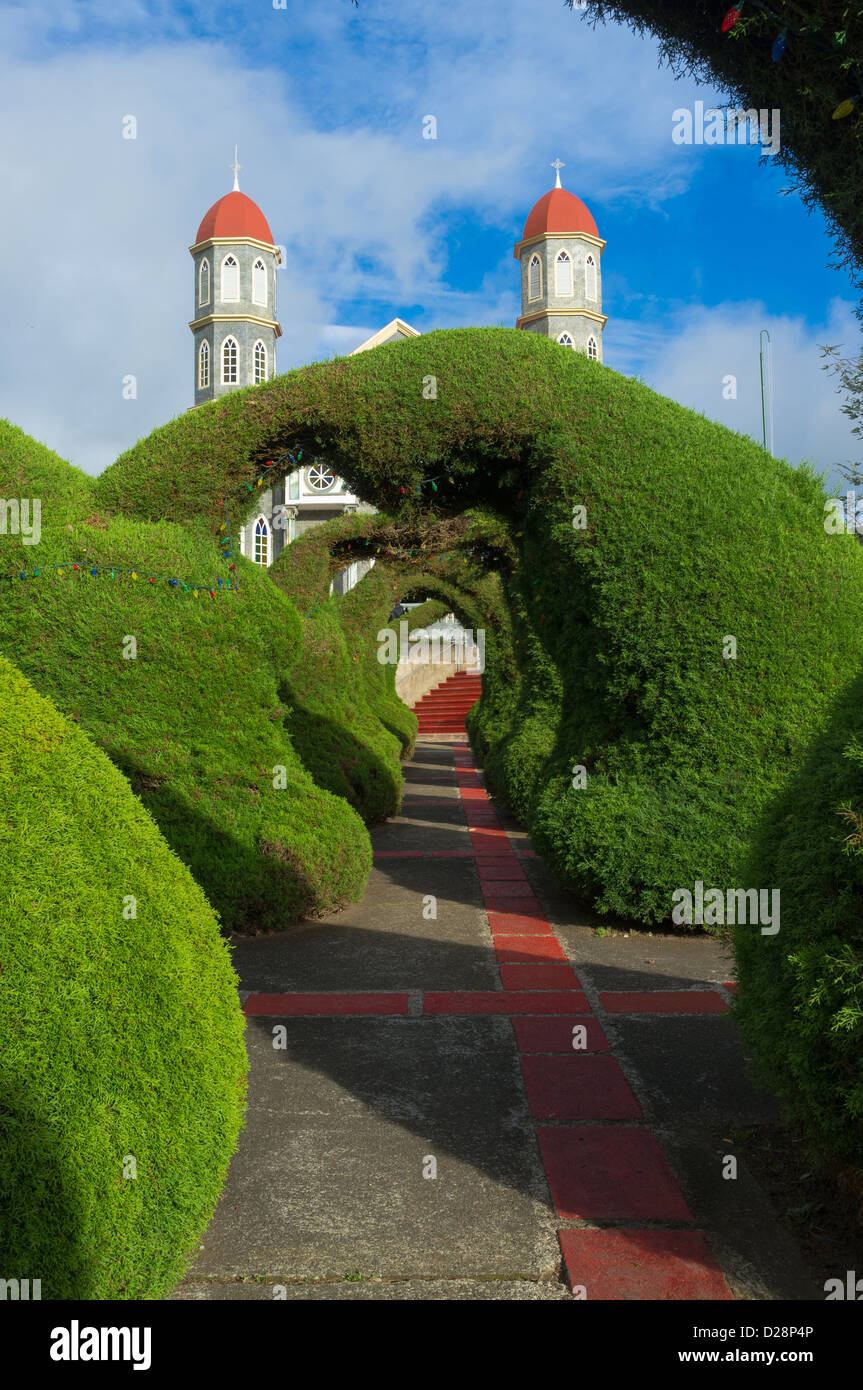 Zarcero church as seen through the arches of its ornamental garden ...
