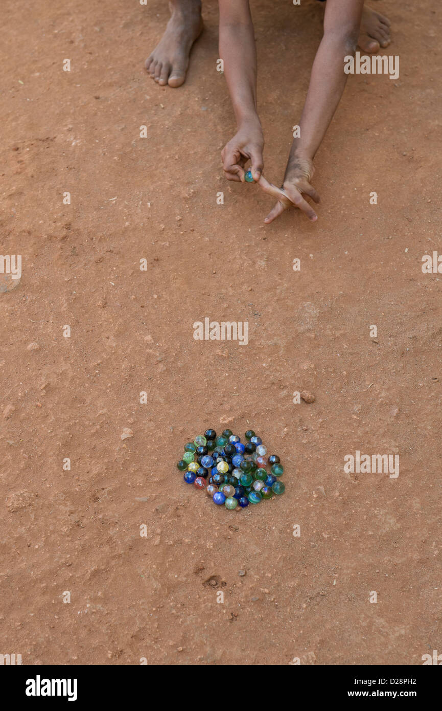 Indian boys hands holding marbles hi-res stock photography and images ...