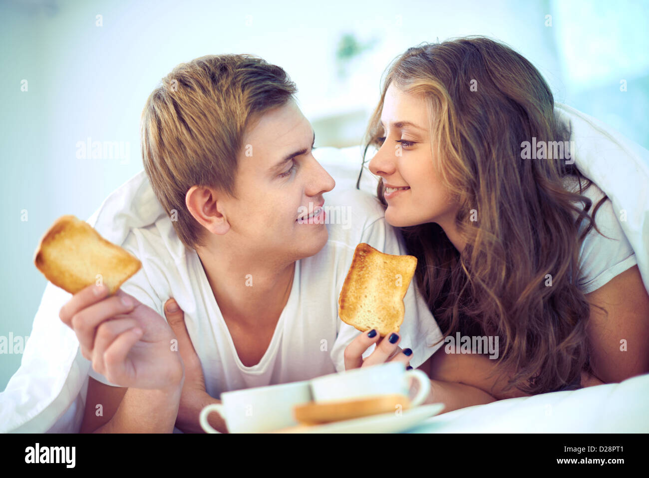 Couple having breakfast together exchanging loving looks Stock Photo ...