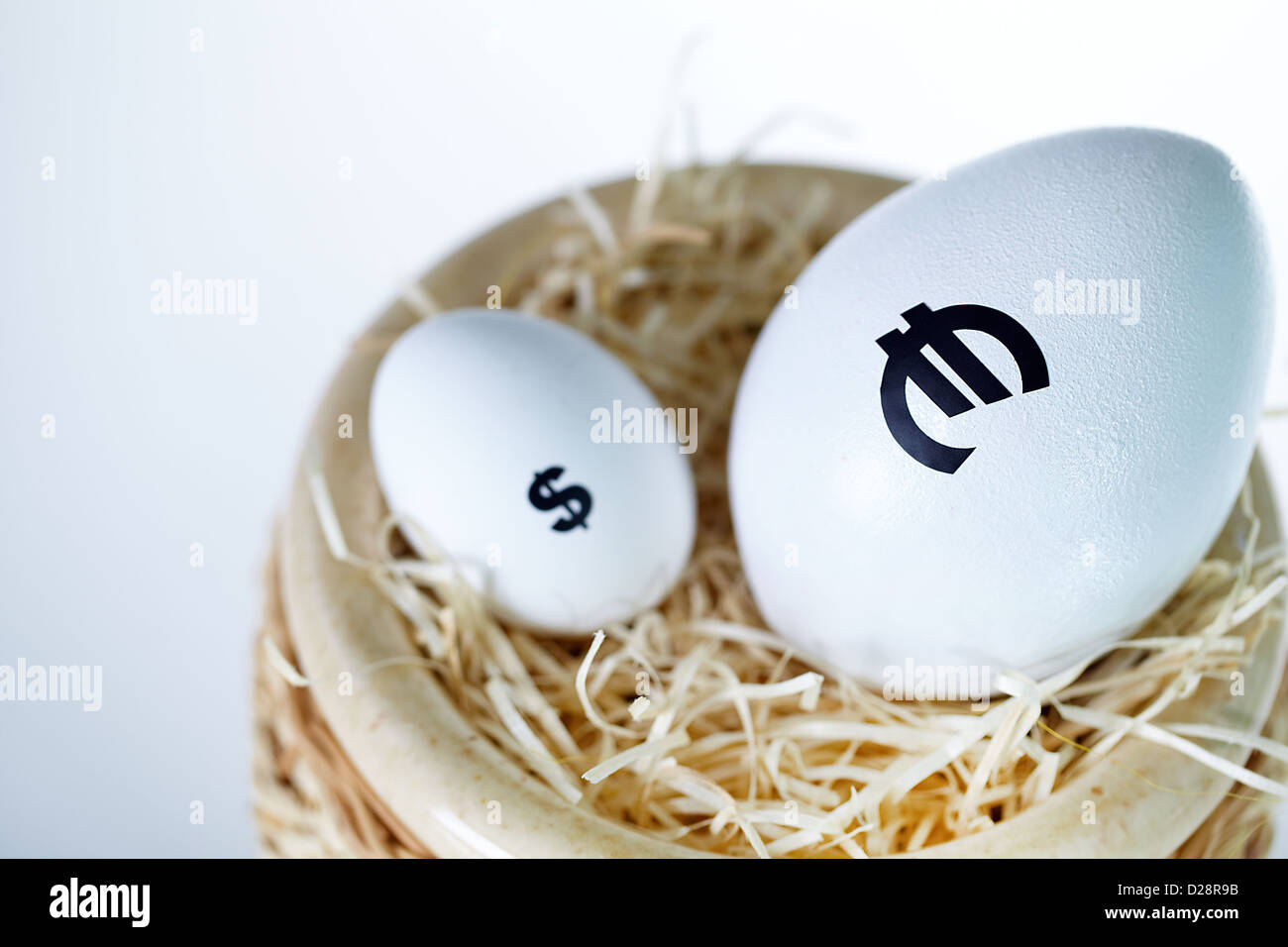 Image of big white egg with euro sign and small egg with dollar sign in ...