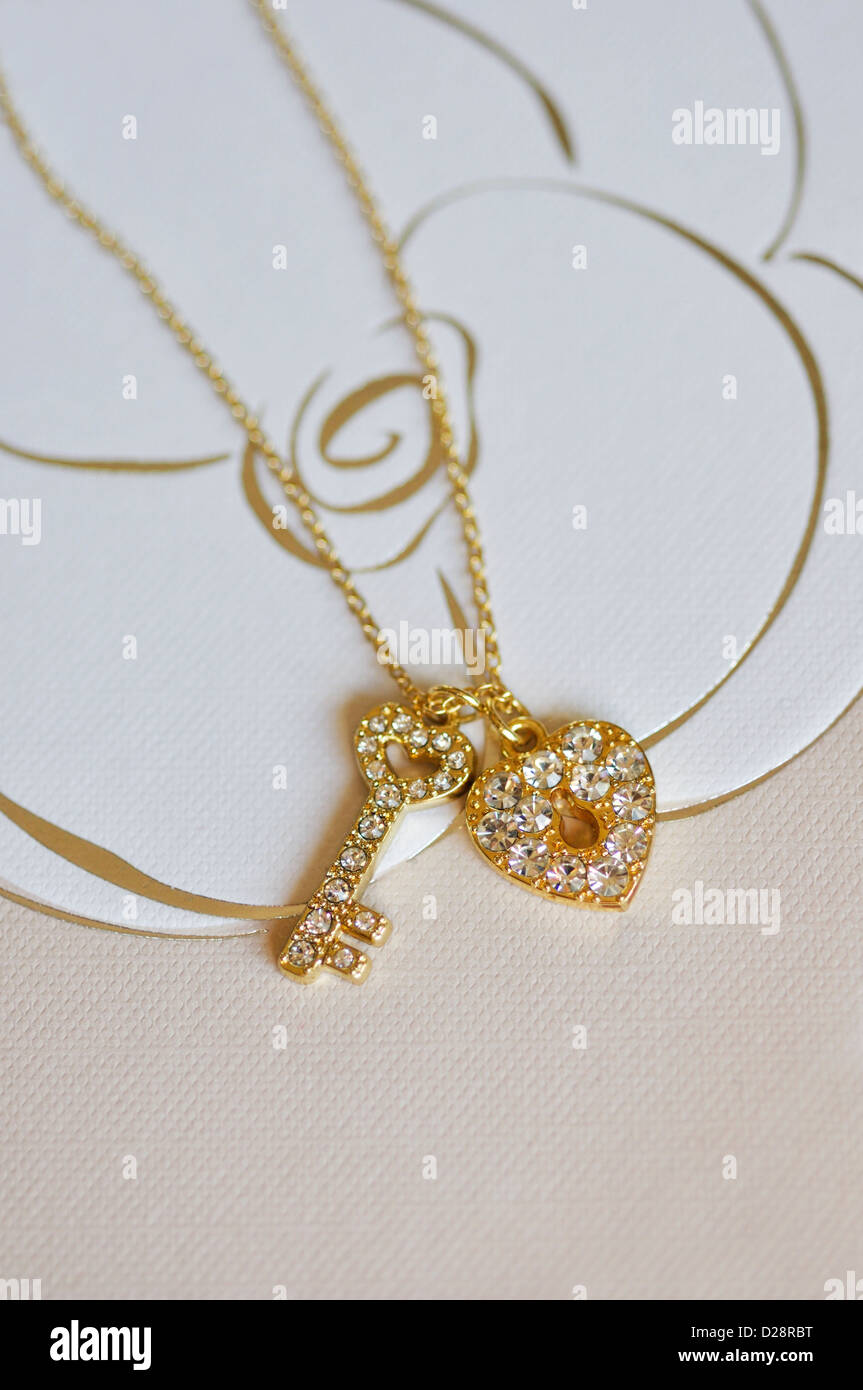 Chain and pendant - lock and key Stock Photo - Alamy