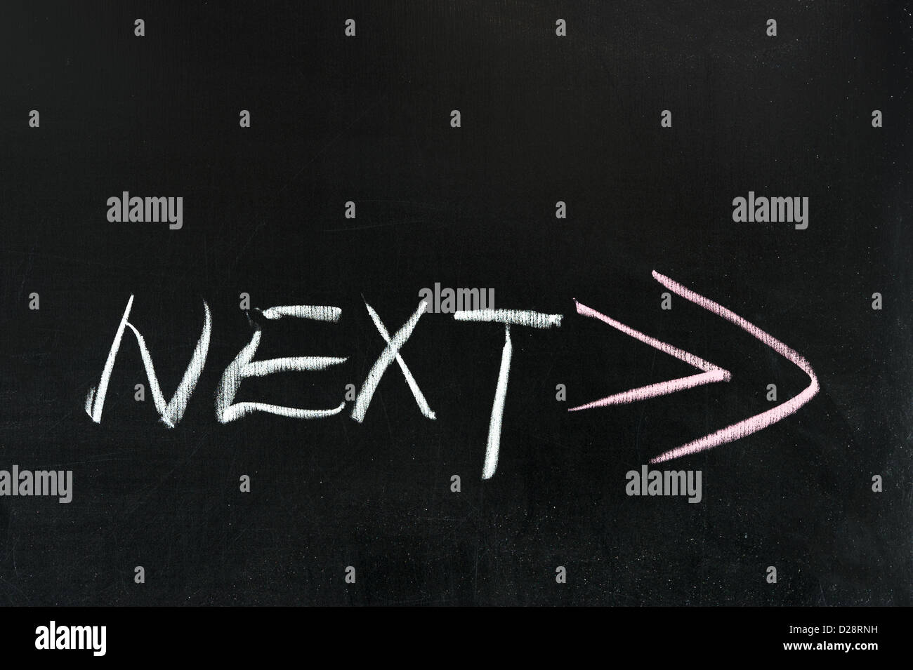 Next sign drawn on the blackboard Stock Photo - Alamy