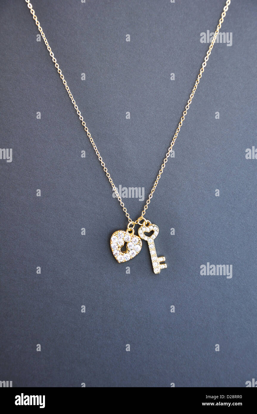 Chain and pendant - lock and key Stock Photo - Alamy