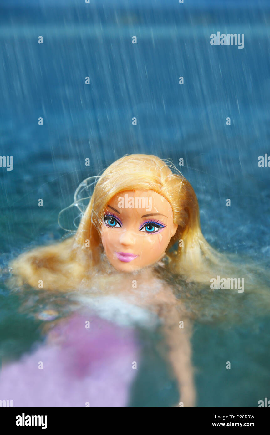 Doll in water Stock Photo - Alamy