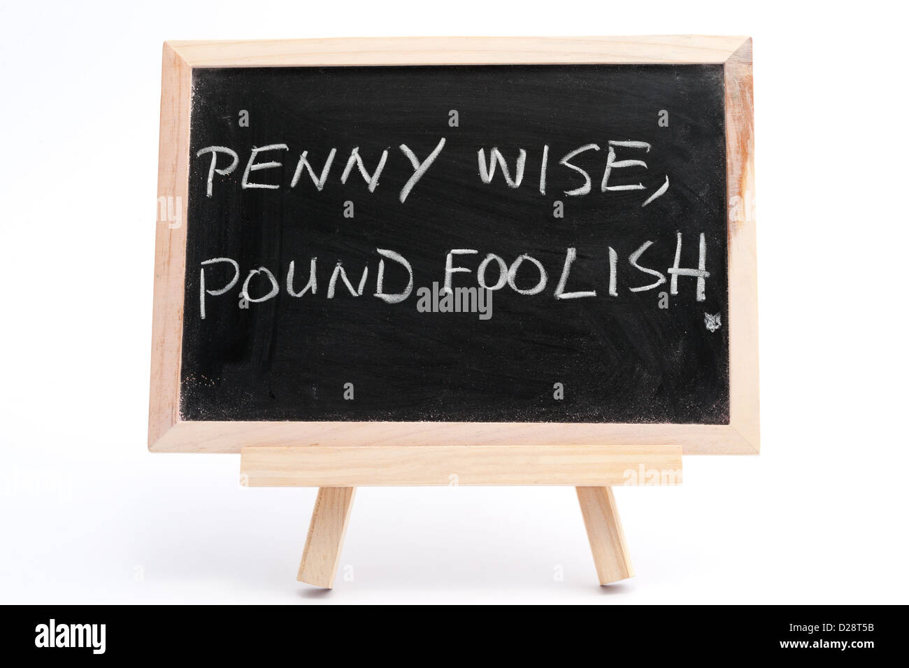 "Penny wise, pound foolish" saying written on blackboard over white ...