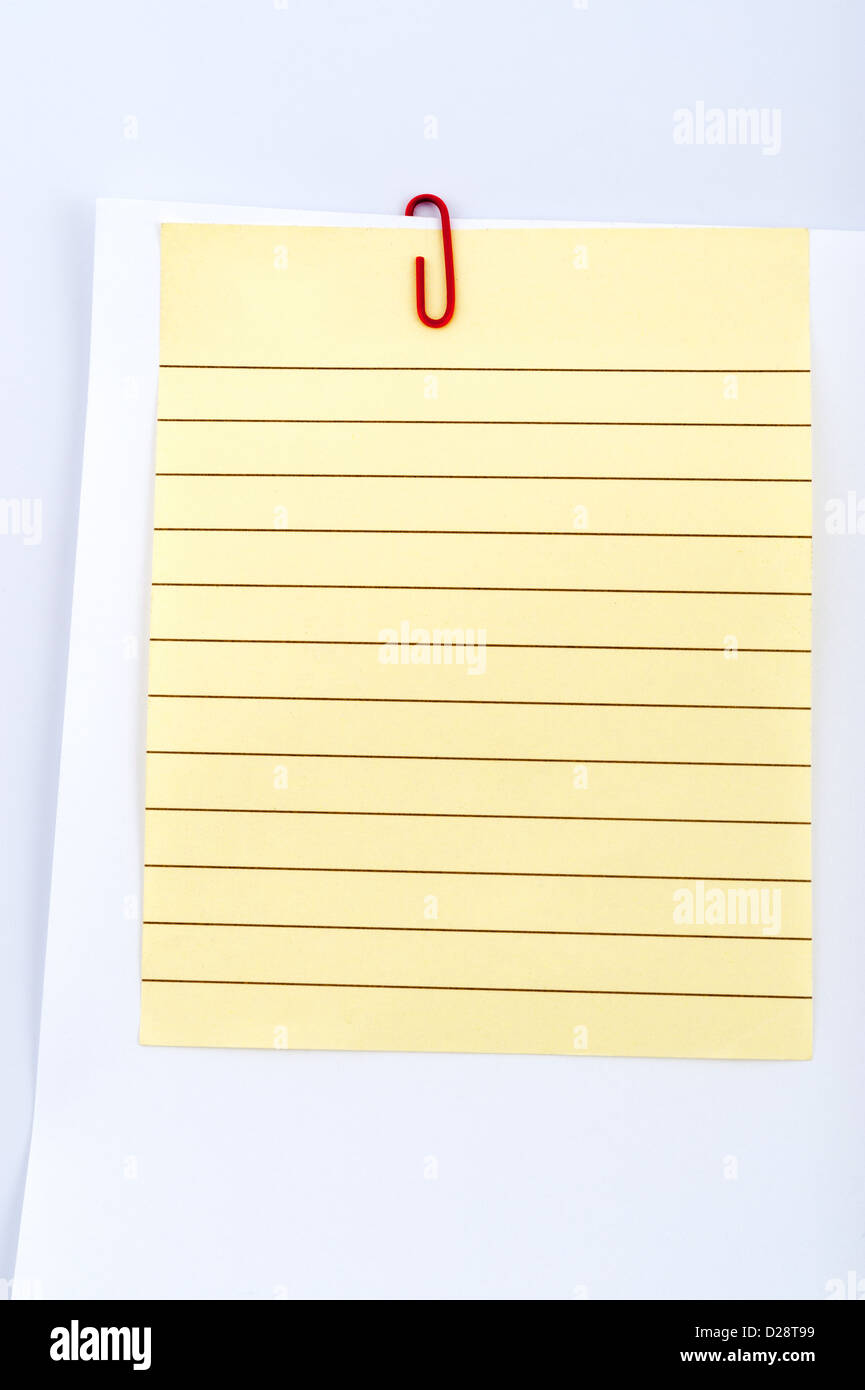 Paper with clip against white background Stock Photo - Alamy
