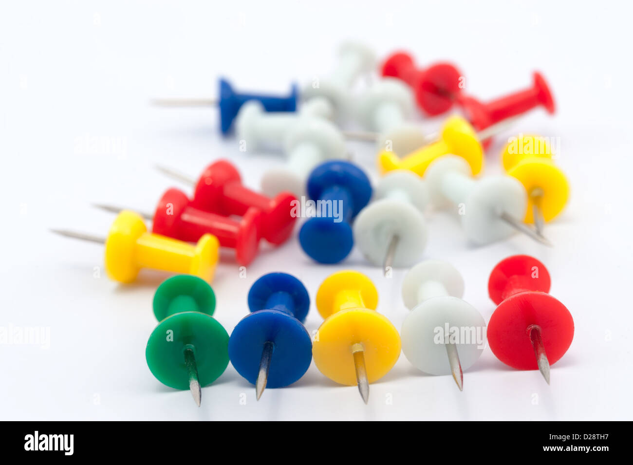 Group of colorful pushpins on white background Stock Photo - Alamy