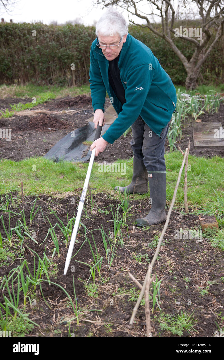 Man hoeing hi-res stock photography and images - Alamy
