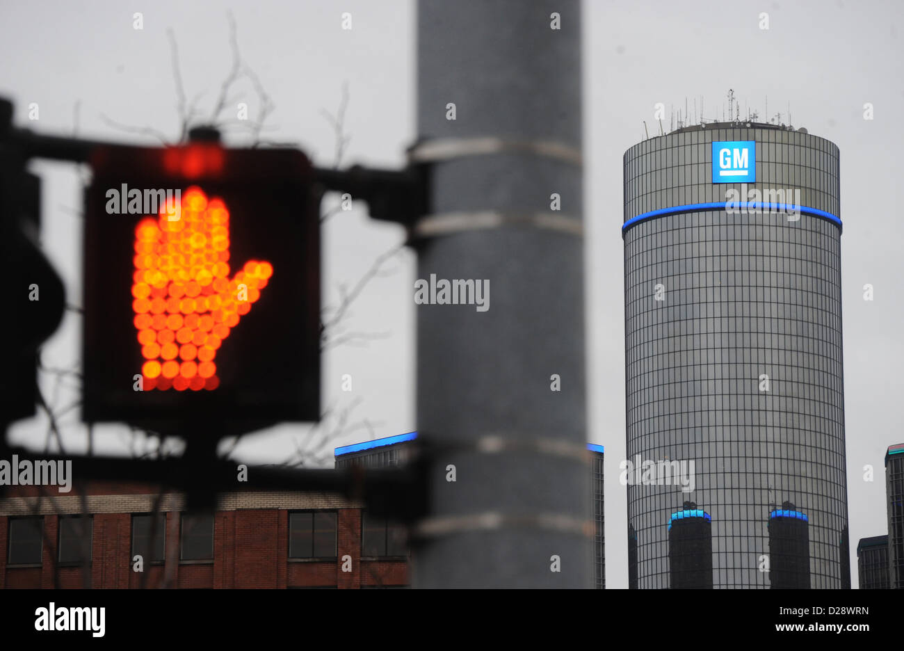 A pedestrian traffic light indicates red near the headquarter office ...