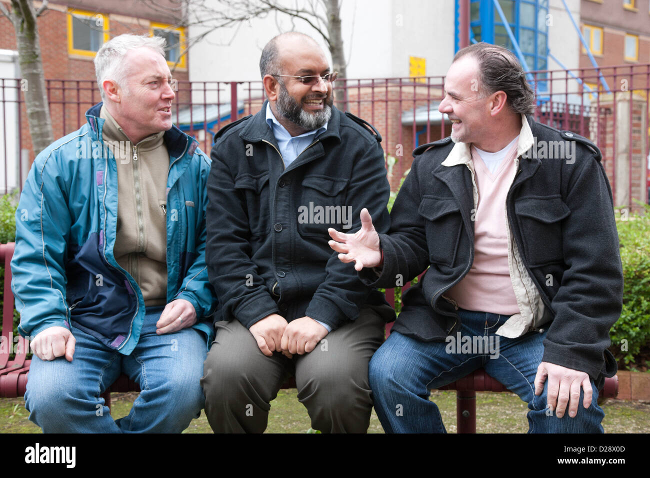 Three men chatting Stock Photo - Alamy